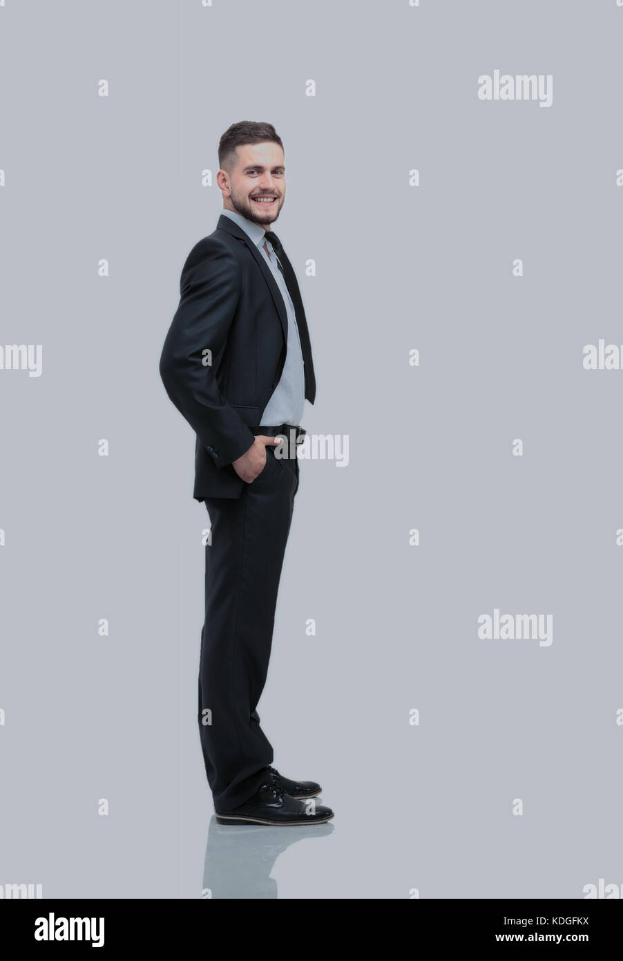 Portrait of the young smiling turned businessman isolated on a white ...