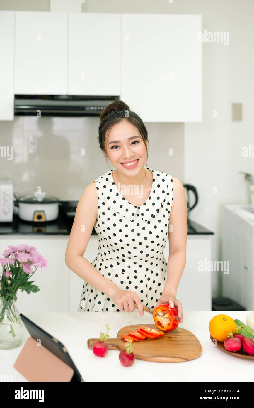 Portrait of young asian beautiful woman cooking in kitchen Stock Photo ...
