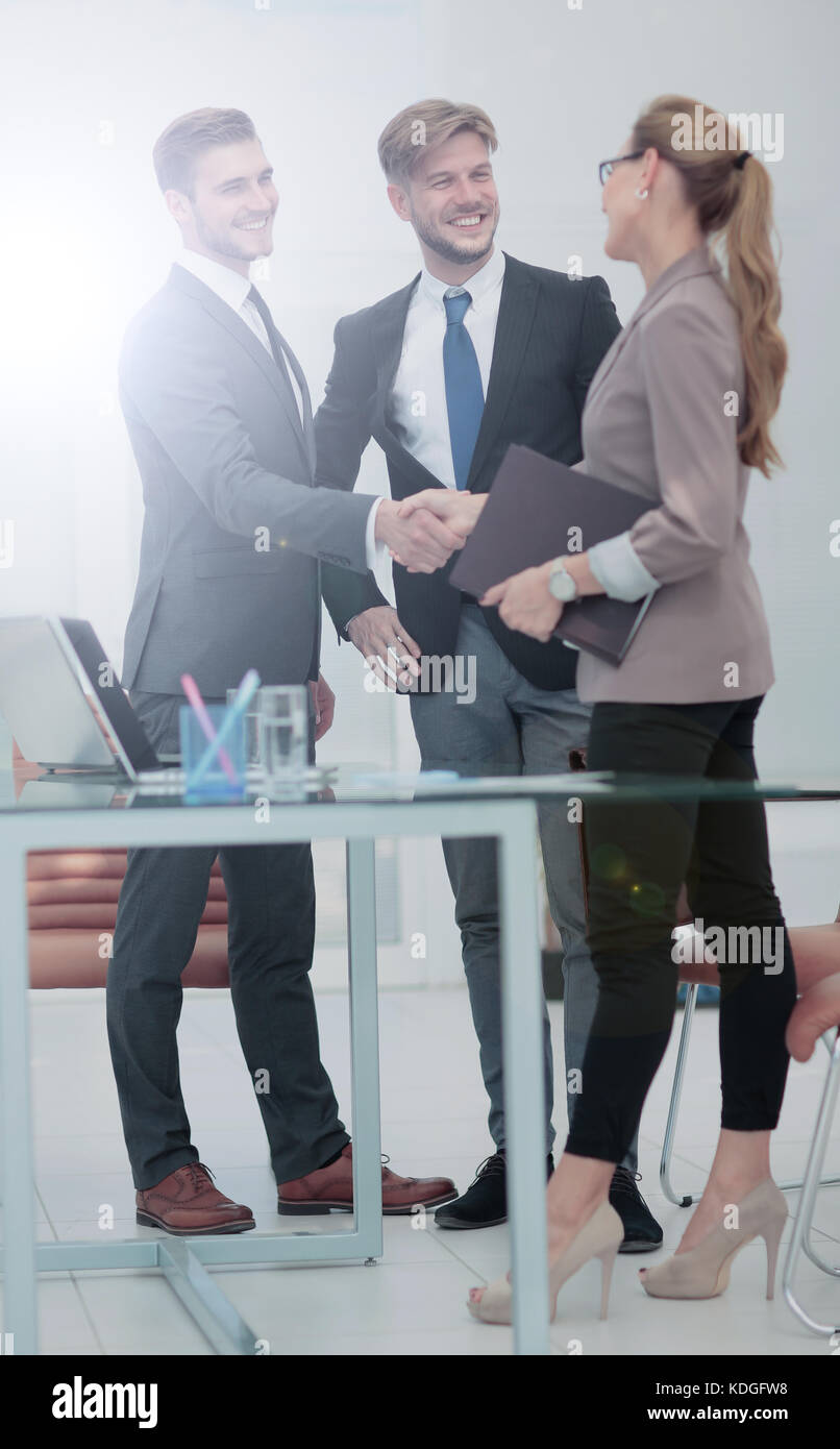 Business people closing a deal and handshaking at the office Stock ...