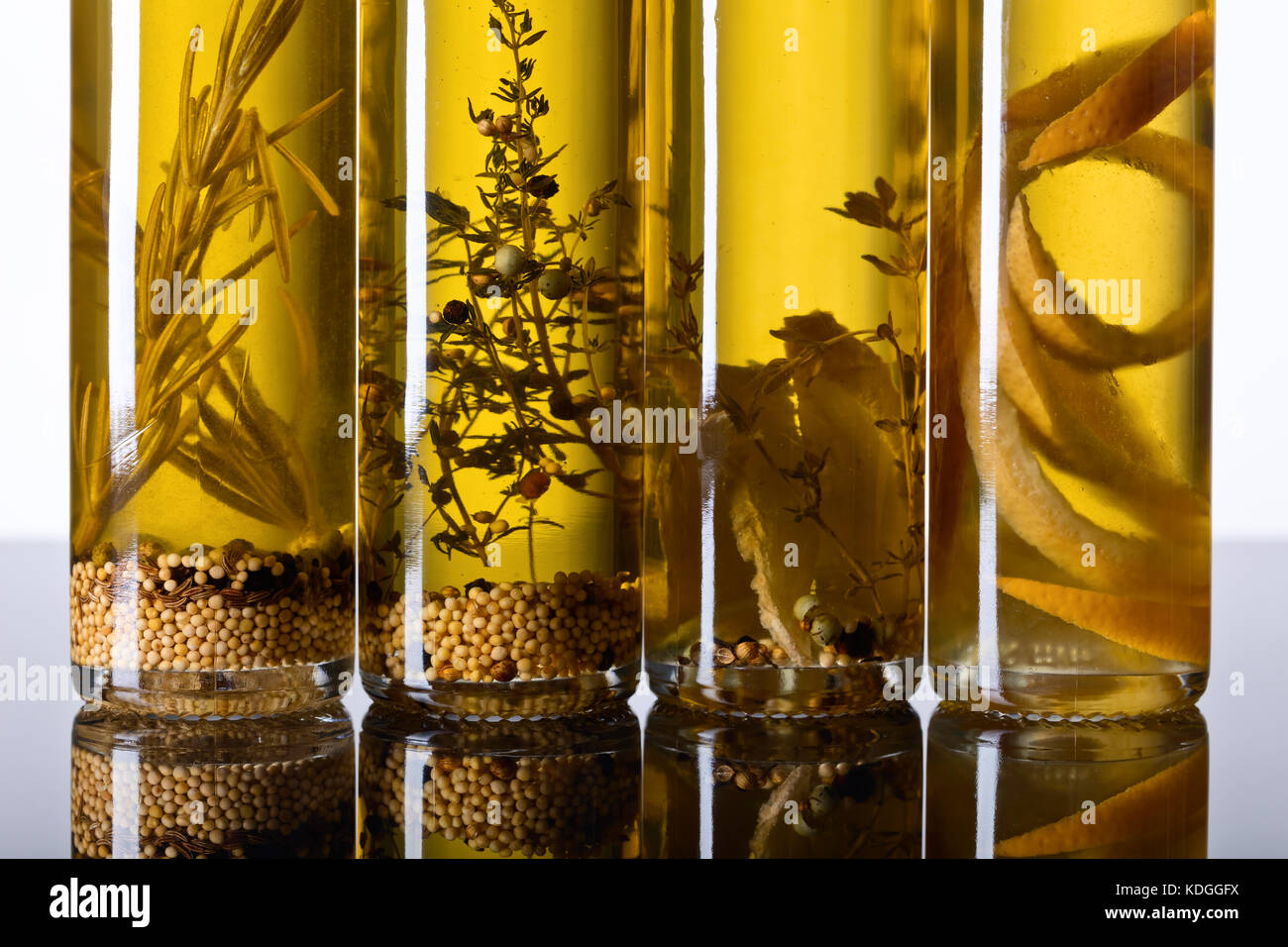 Olive oil with different spices and herbs Stock Photo - Alamy