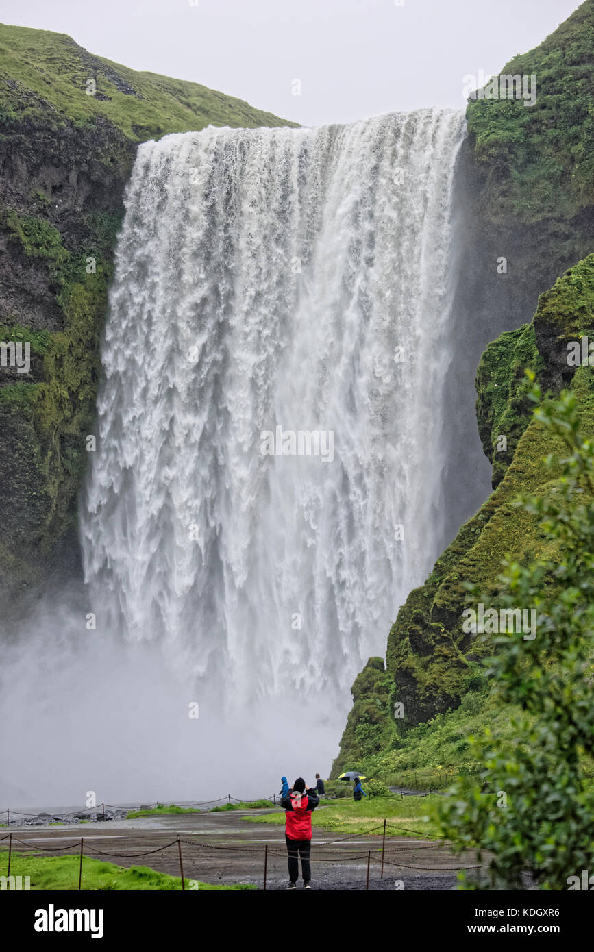 Seljalandsfoss waterfall plunging 60m from the cliff above, Sudhurland ...