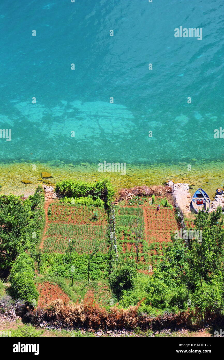 Clear waters and lake shore gardens that represent traditional land use ...