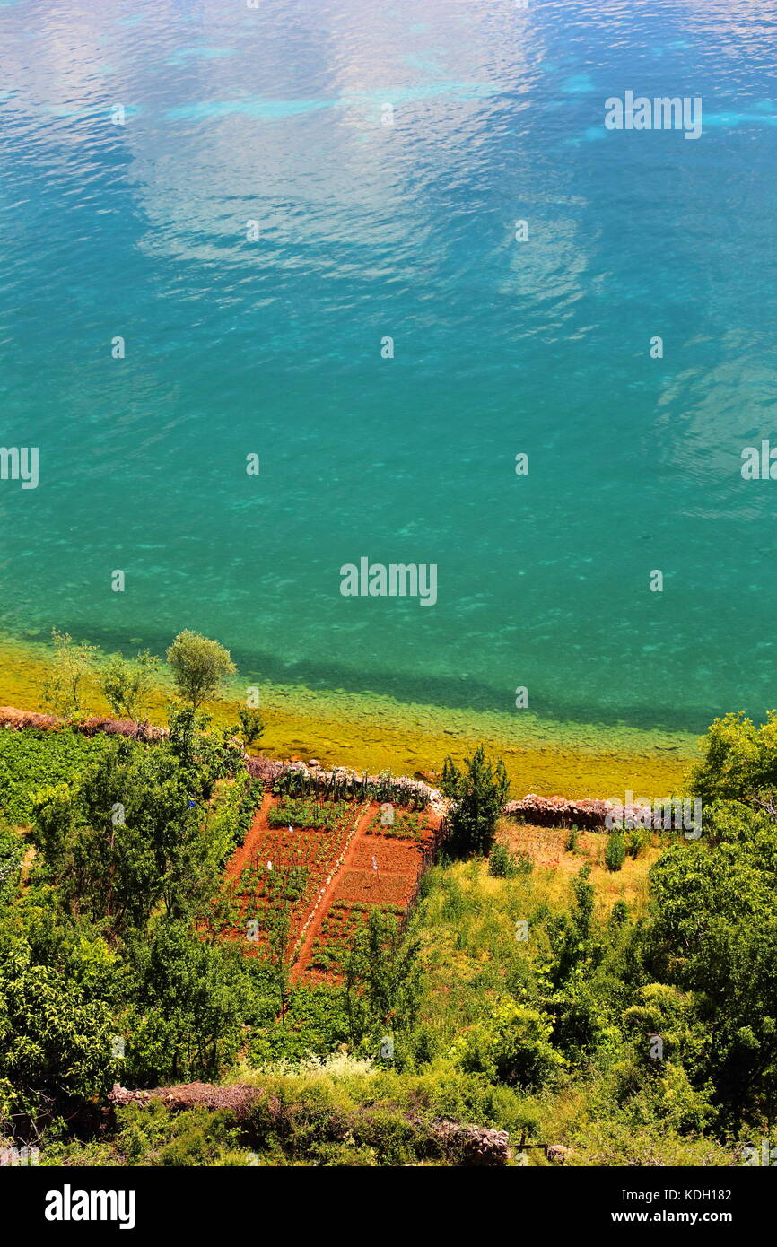 Clear waters and lake shore gardens that represent traditional land use ...