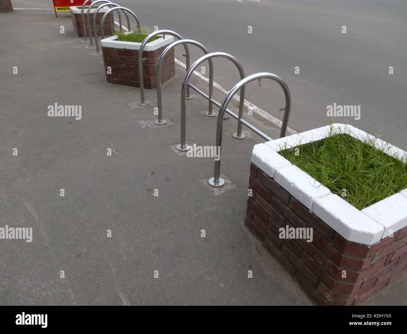 Metal bicycle parking near the road Stock Photo - Alamy
