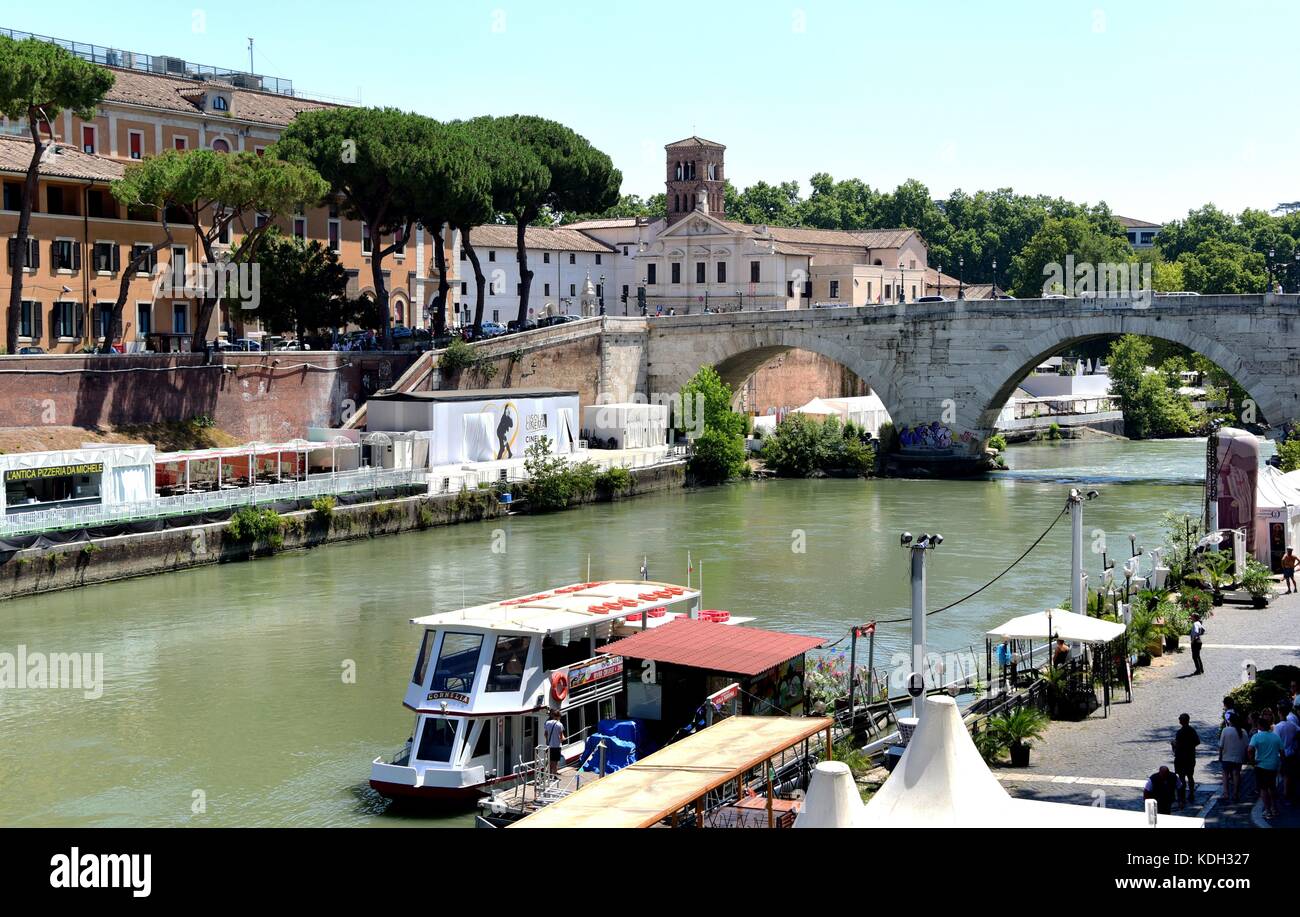 Bridge Ponte Cestio and church Basilica di San Bartolomeo in Rome ...