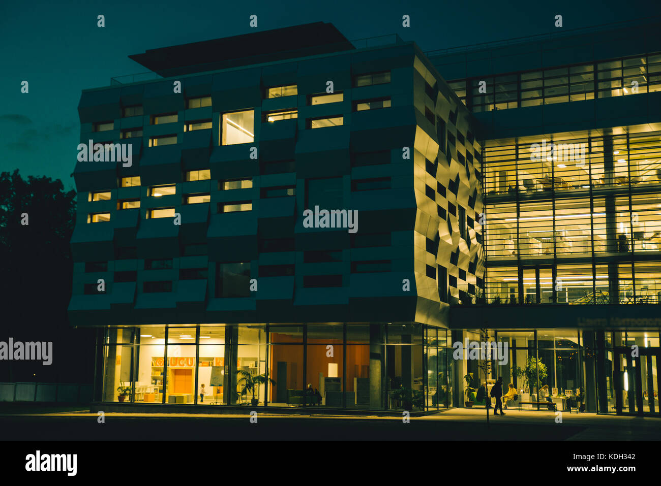 light in glass building at night Stock Photo - Alamy