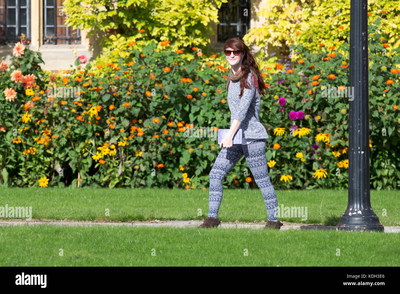 Cambridge student Jess Shaw walking back to college with a book Stock ...