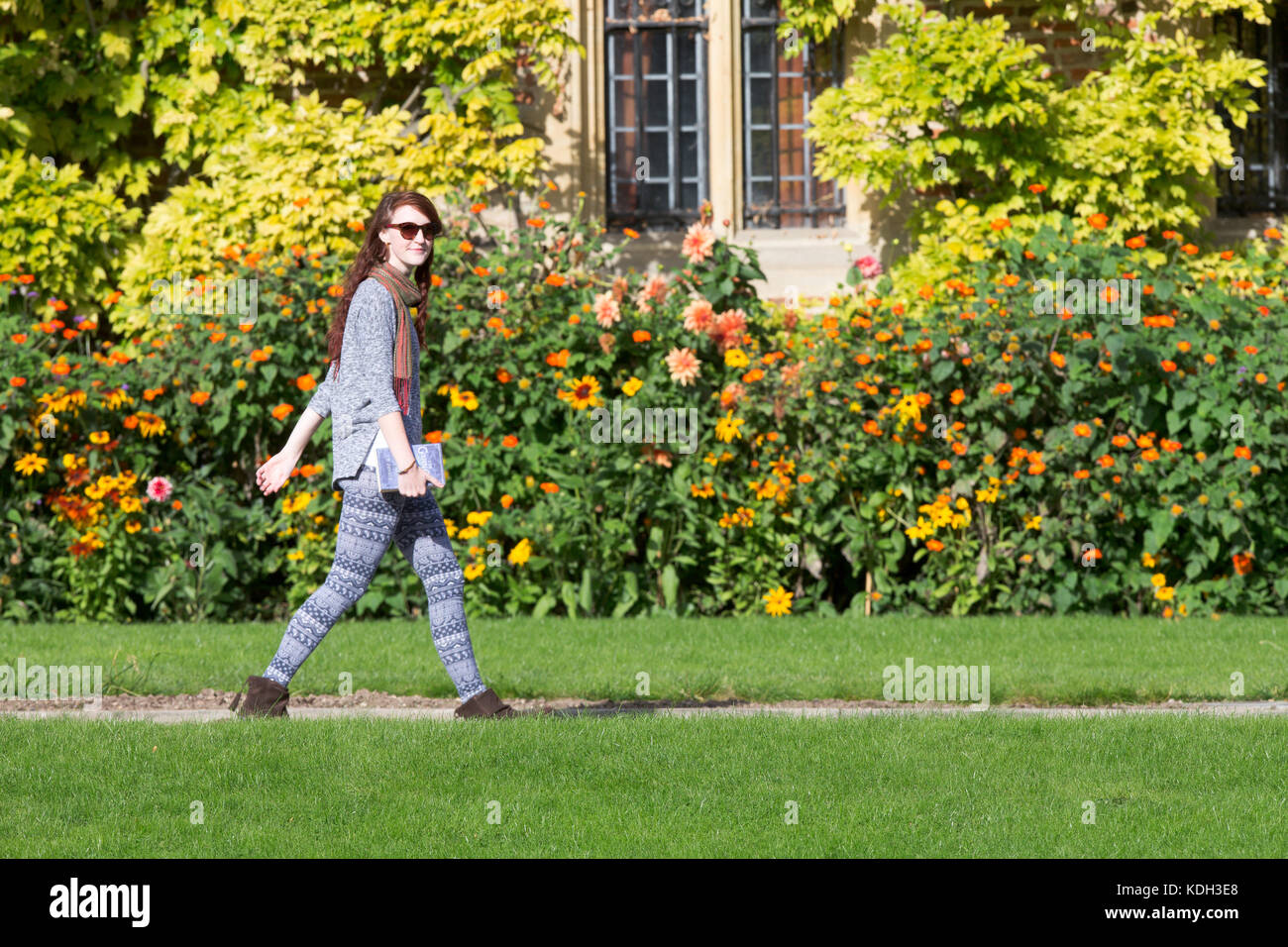 Cambridge student Jess Shaw walking back to college with a book Stock ...