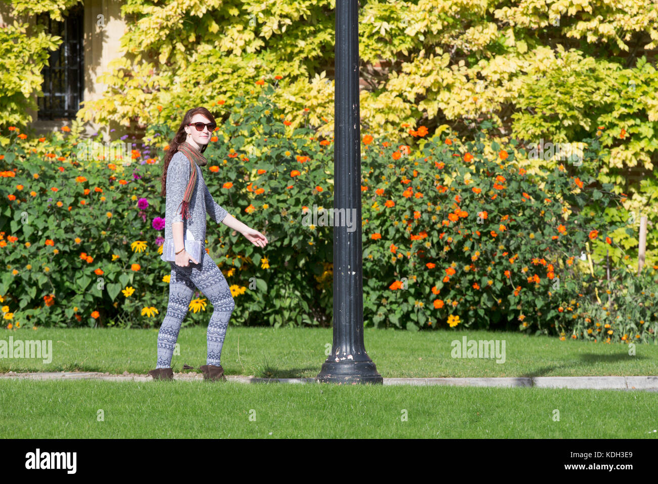 Cambridge student Jess Shaw walking back to college with a book Stock ...