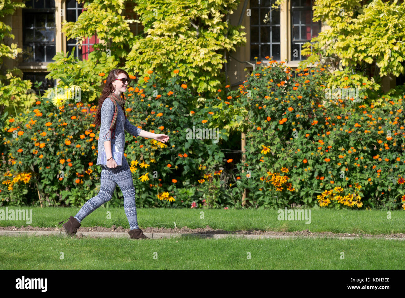 Cambridge student Jess Shaw walking back to college with a book Stock ...