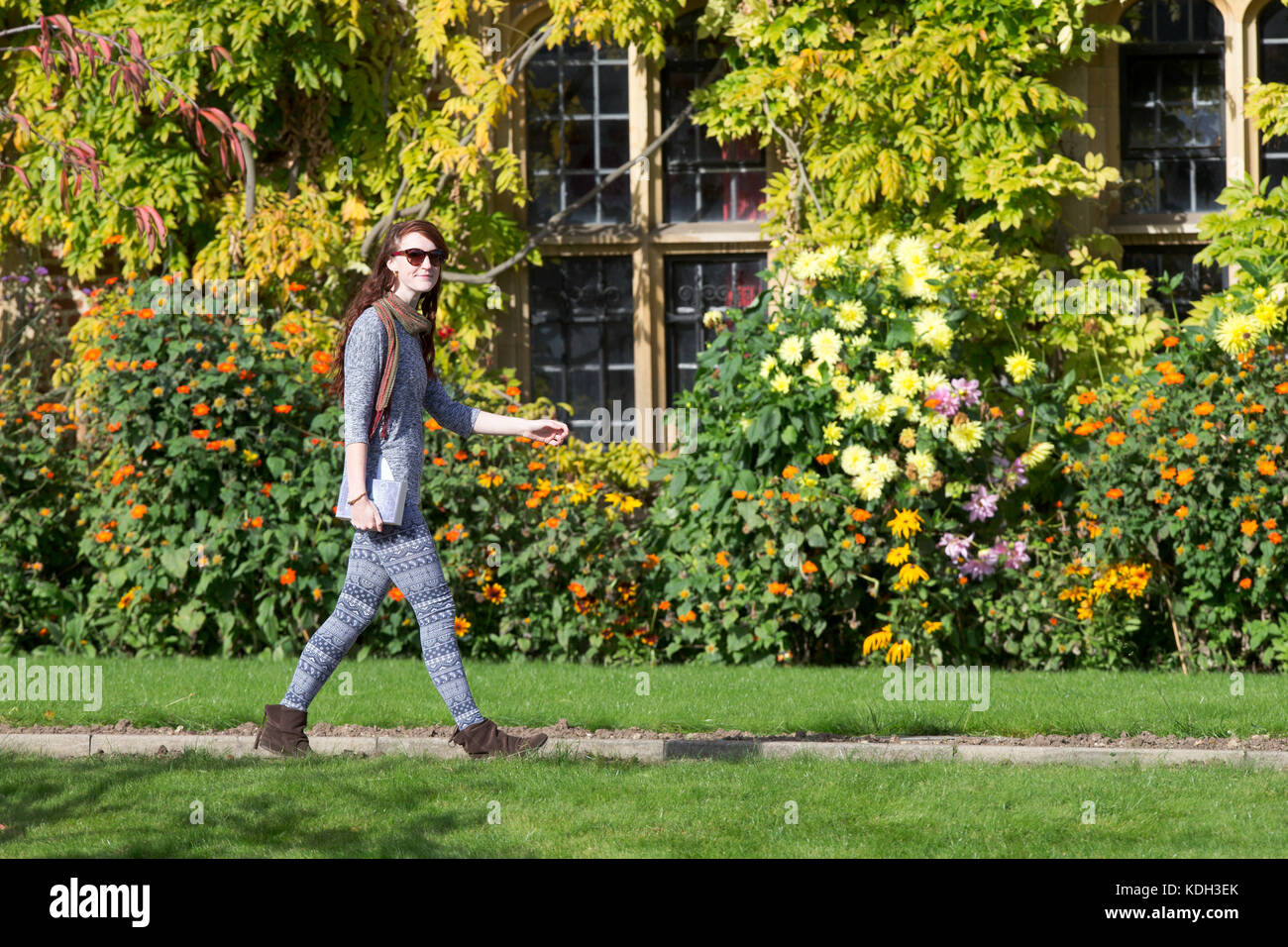 Cambridge student Jess Shaw walking back to college with a book Stock ...