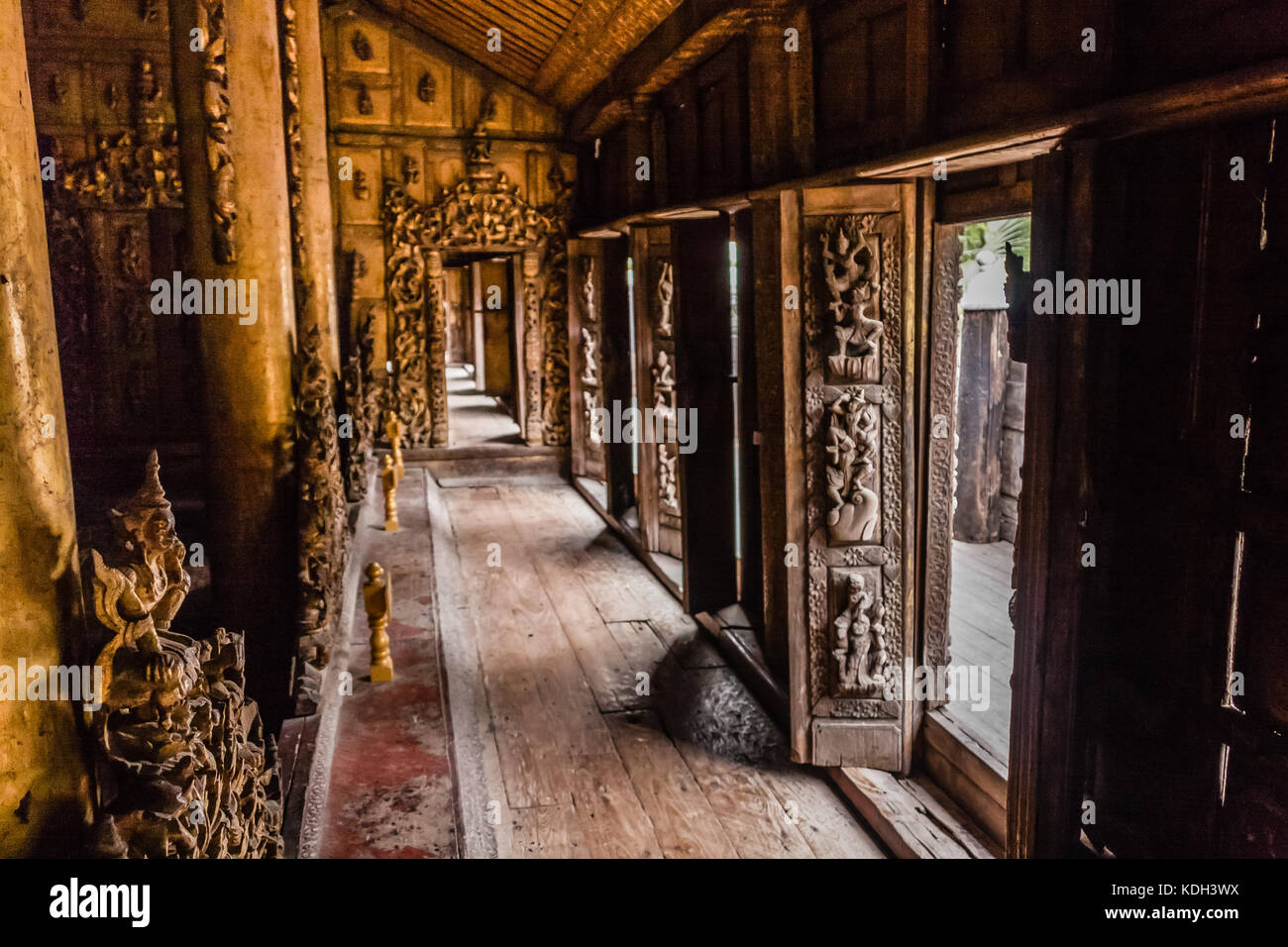 A traditional Burmese wood carved interior of Shwenandaw Monastery ...