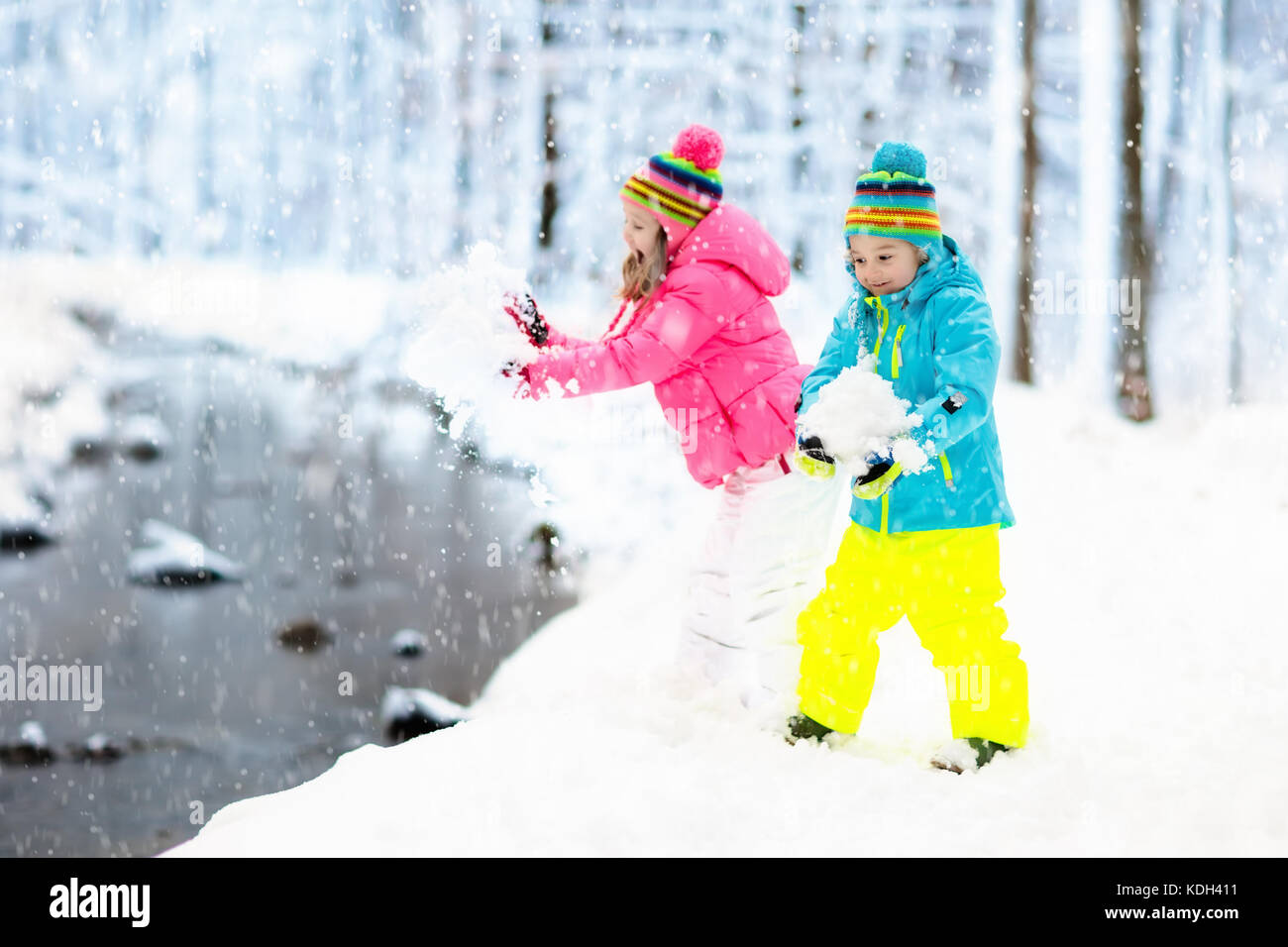 Boy in park throwing snow hi-res stock photography and images - Alamy