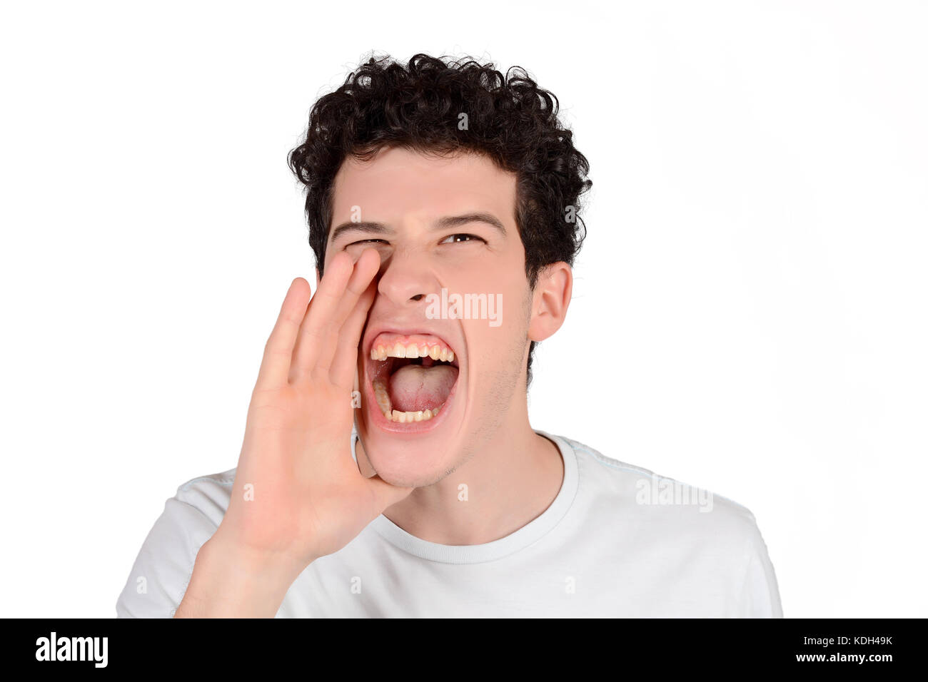 Portrait of a young man shouting. Isolated white background Stock Photo ...