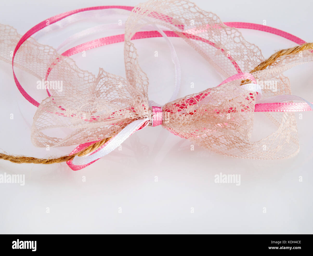 Girly, feminine vintage white and pink ribbons with bow, beige lace and ...