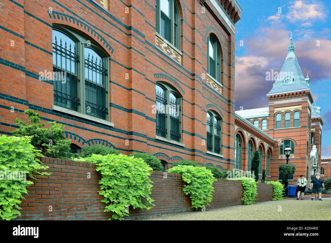 View along the sidewalk of a lovely landscaped wall around the red ...