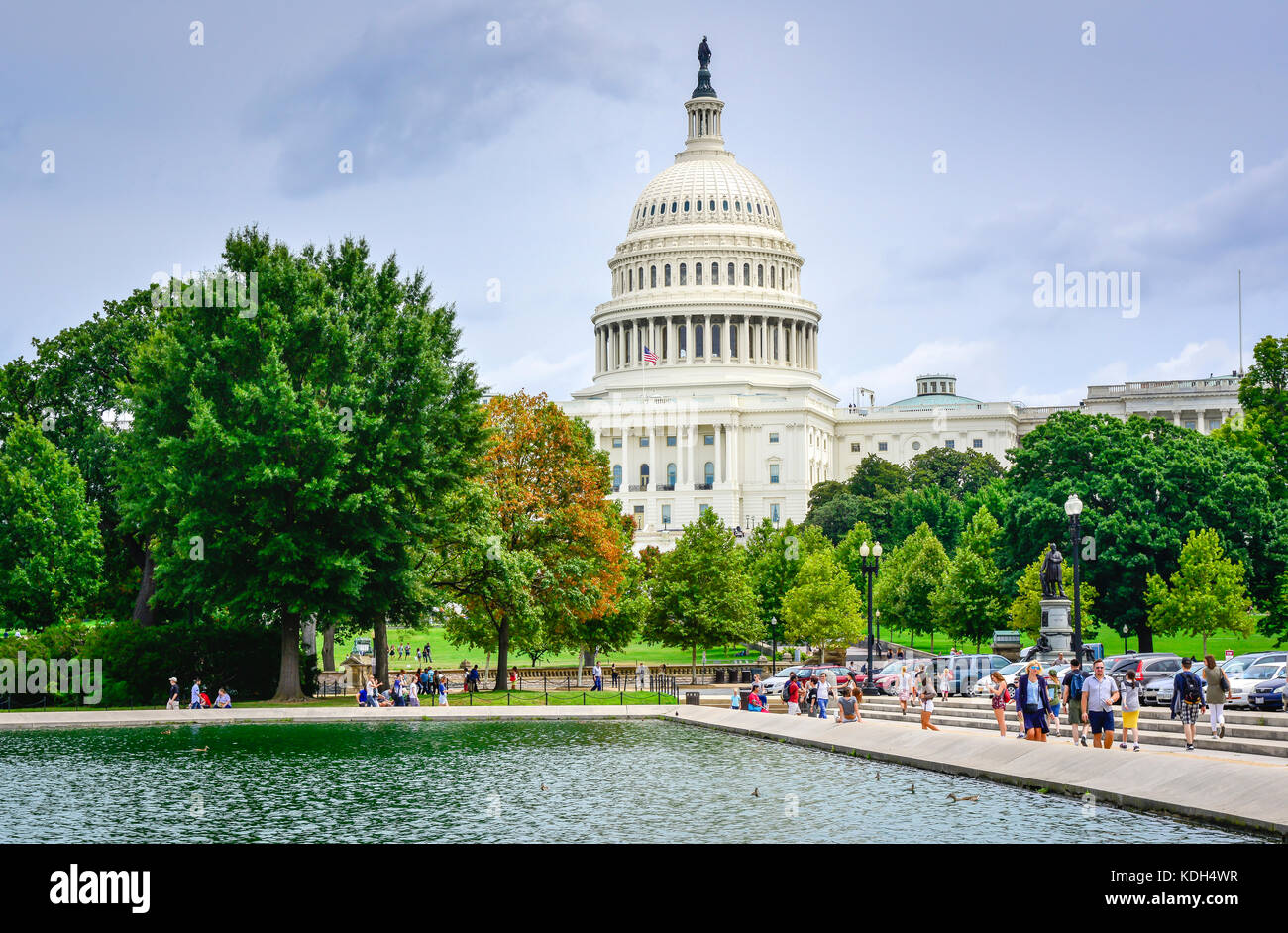 Visitors walk around the grounds of The U.S. Capitol building with ...