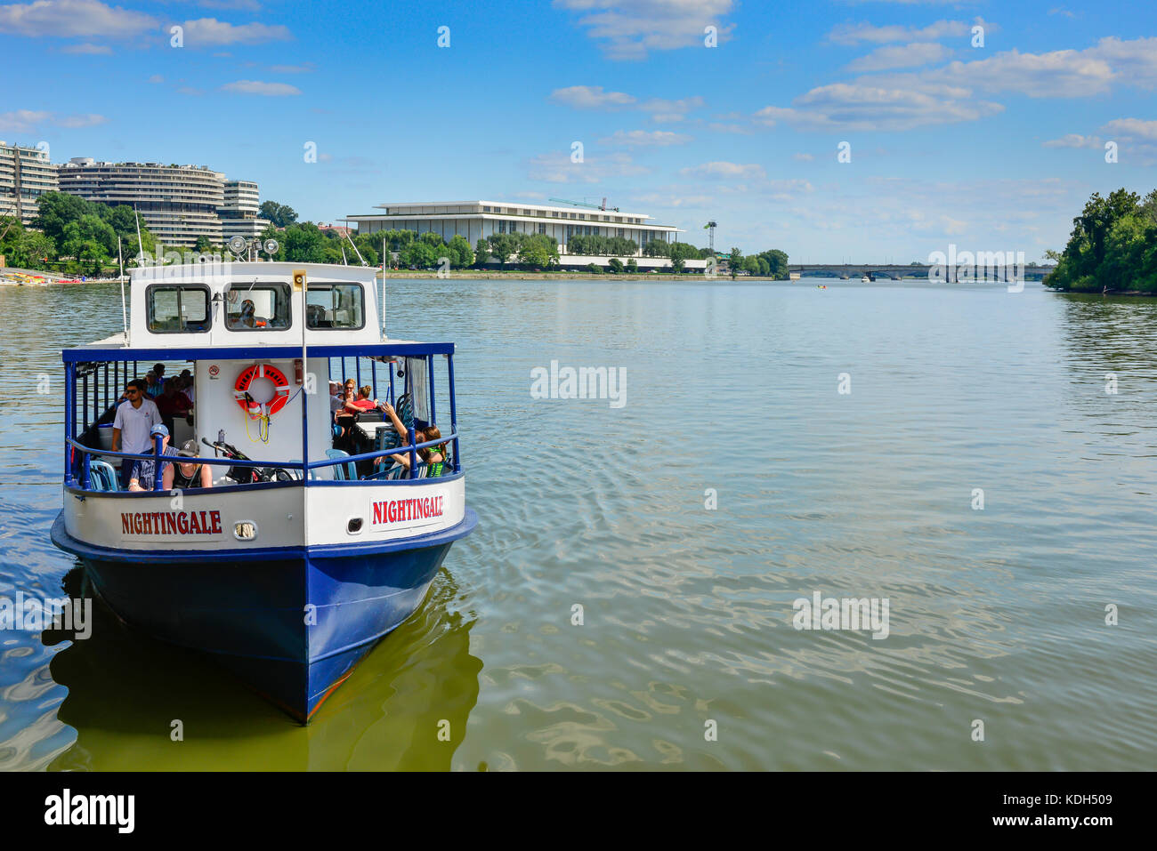 Sightseeing boat cruises the Potomac river near the Washington Harbour ...