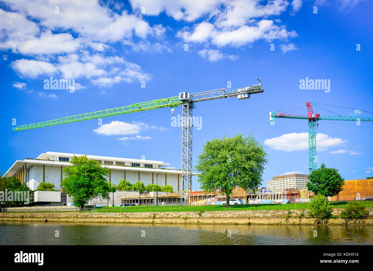 Construction cranes work on the expansion of the famous John F. Kennedy ...