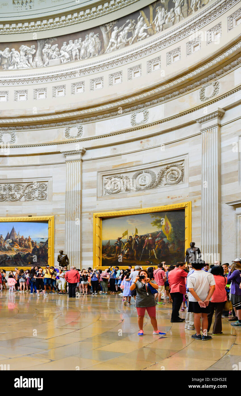Crowds of visitors tour the inside of the rotunda at the US Capitol ...