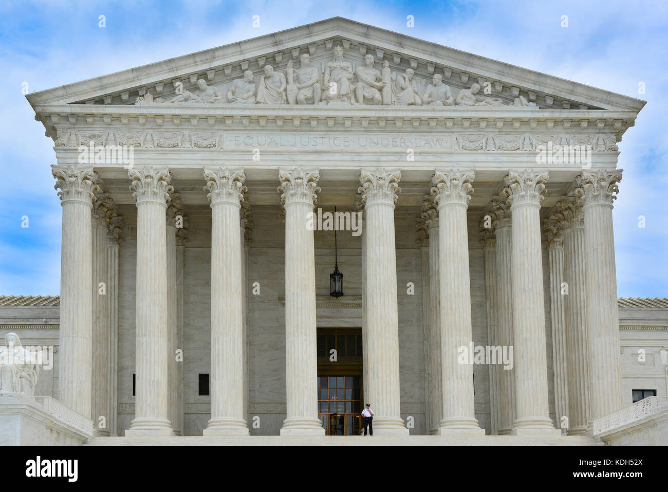 Security guard stands at top of stairs to the entrance to the US ...