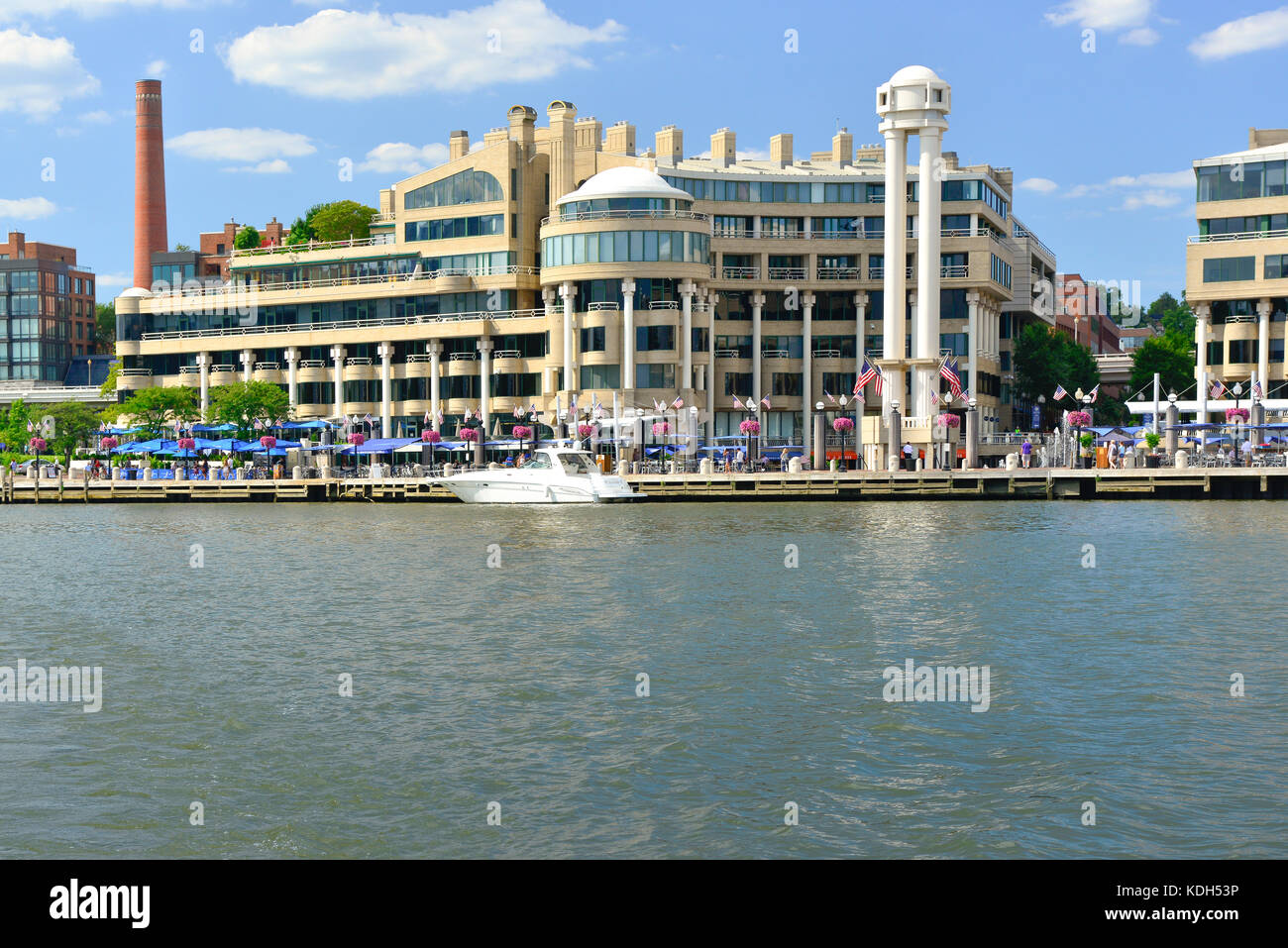 A Power boat docked along side the Washington Harbor mixed use ...