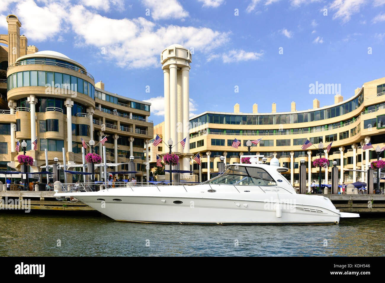 An impressive Power boat docked along side the Washington Harbor mixed ...