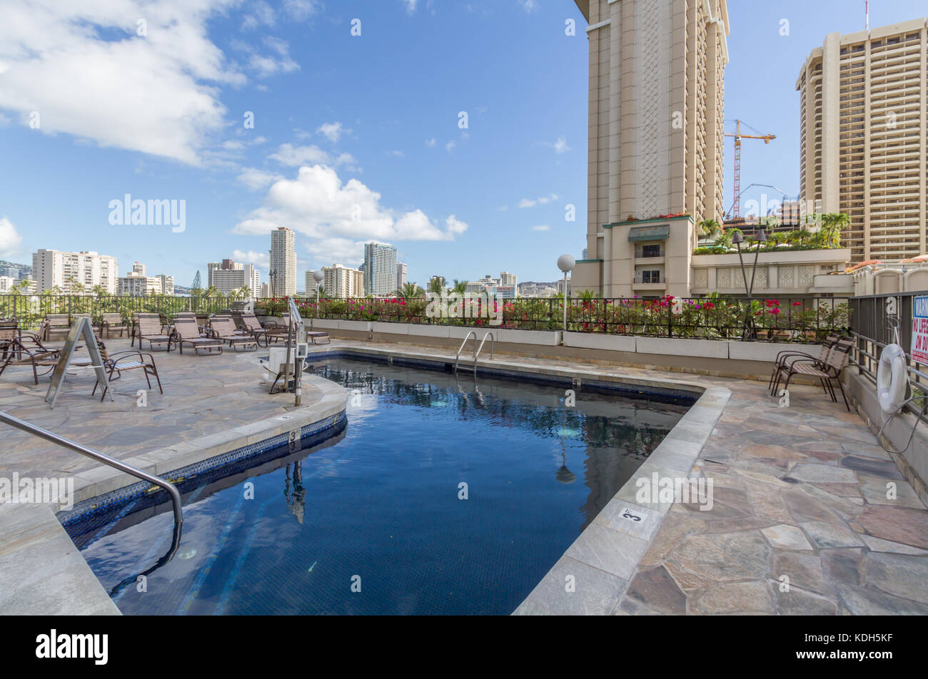 Waikiki hotel pool area Stock Photo - Alamy