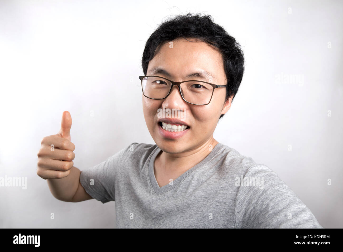 Asian man feels happy Stock Photo - Alamy