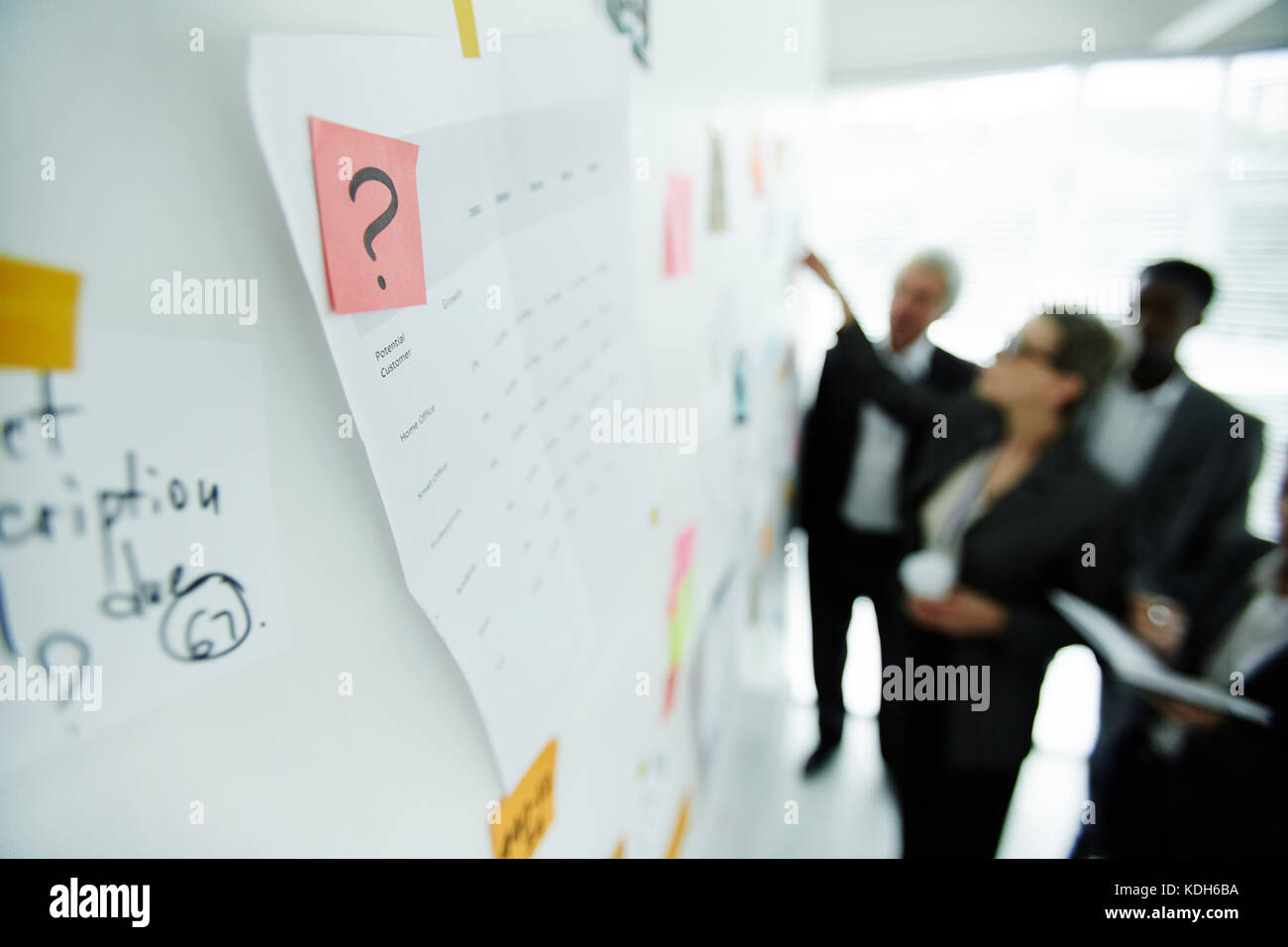 Sticky notepaper with question mark on document with crime description ...