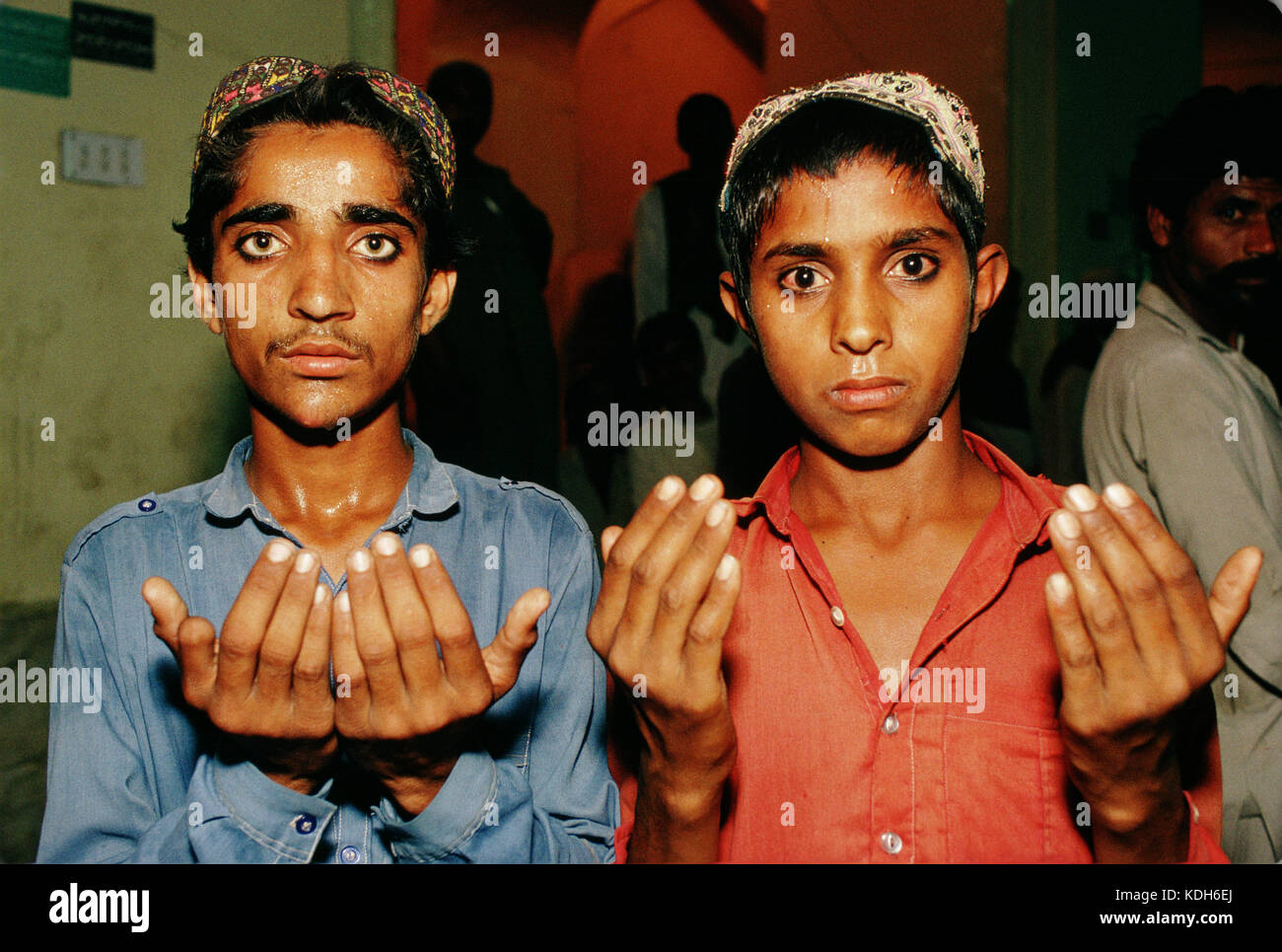 Young men pray after dancing with Dervish dancers at the Mausoleum of ...