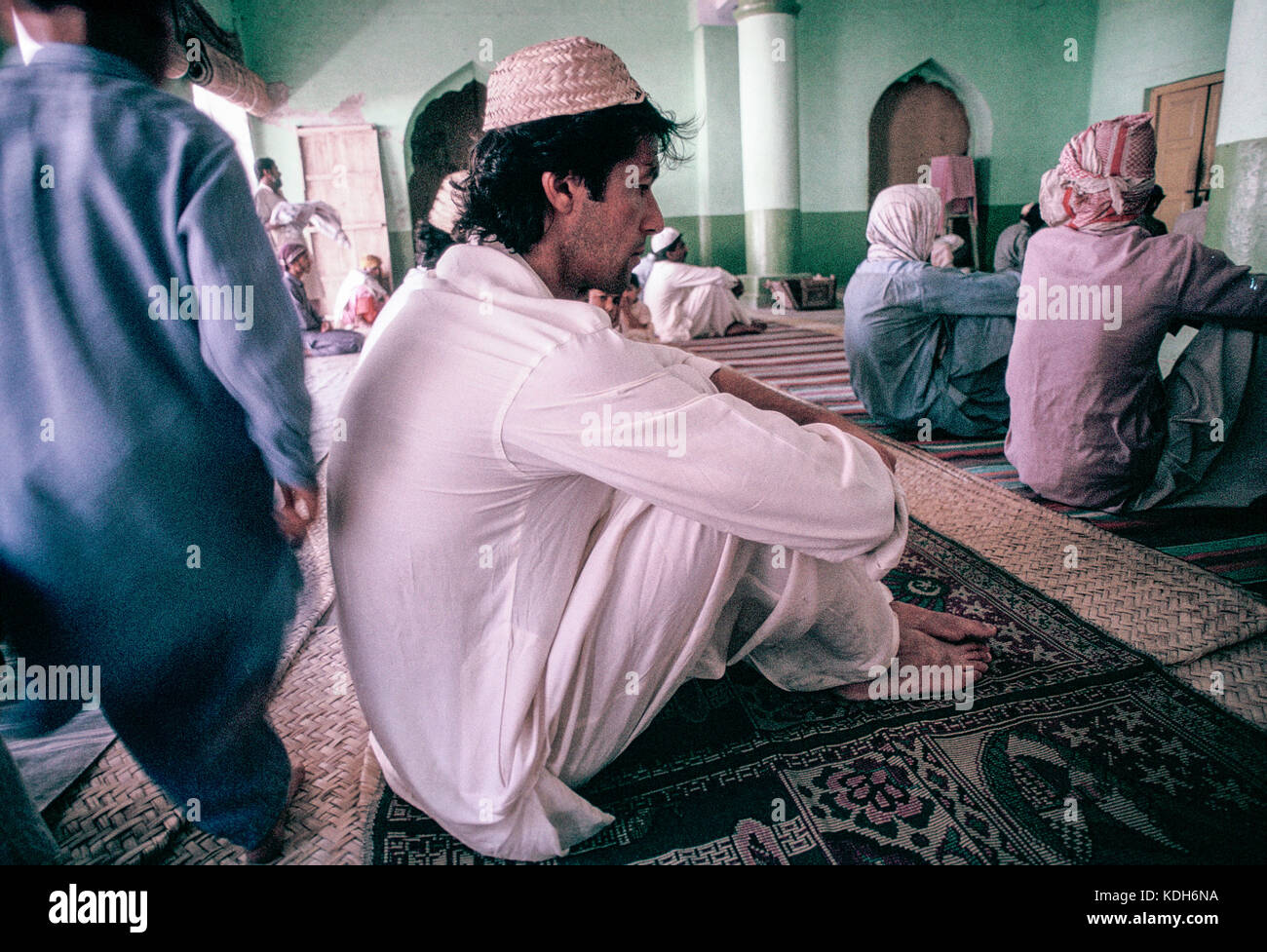 Imran Khan sitting inside a mosque in Pakistan, wearing traditional ...