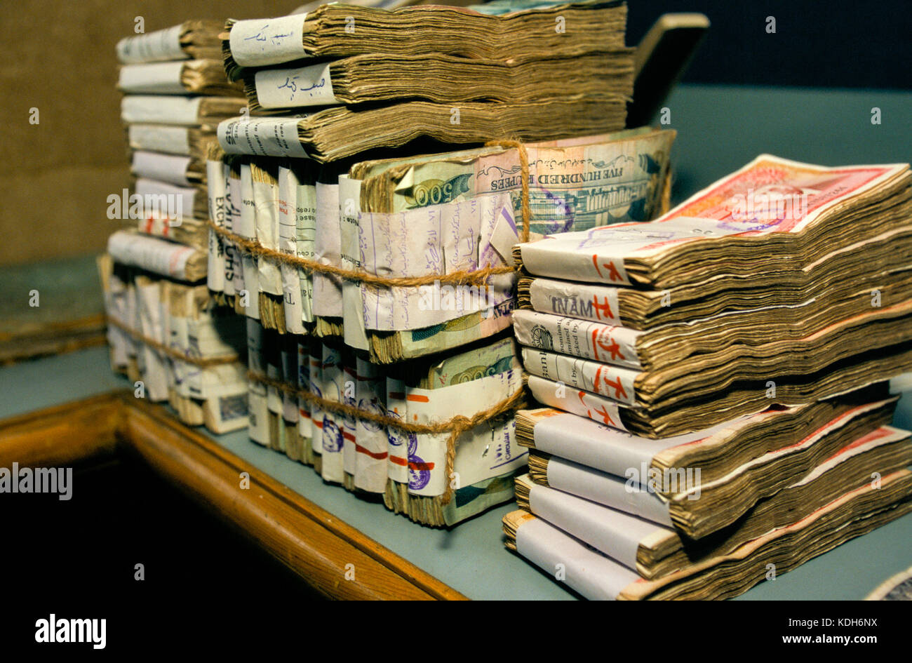 Bundles of Pakistani currency notes stacked on a table Stock Photo - Alamy