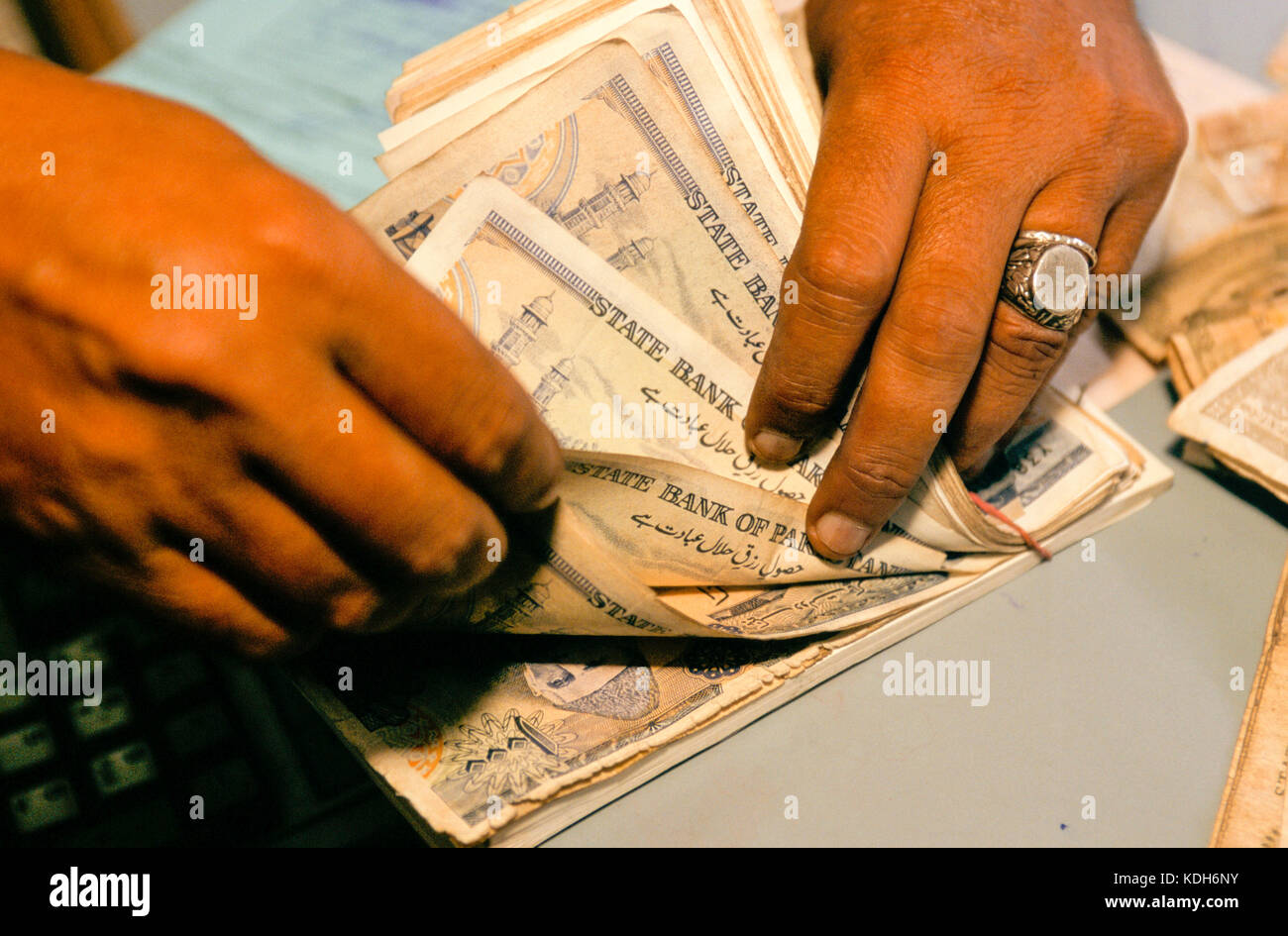 Counting pakistani rupee banknotes bundle hi-res stock photography and ...