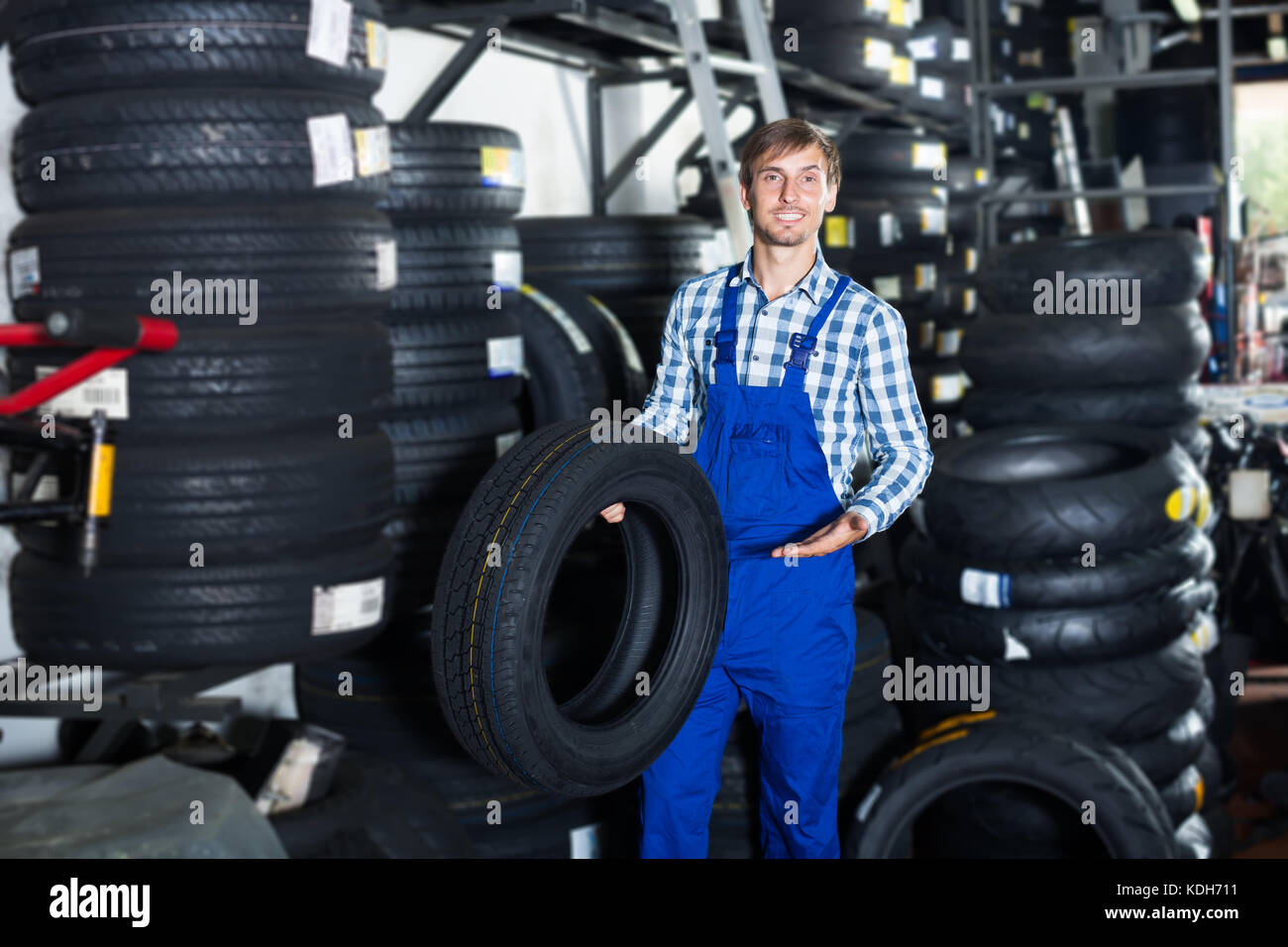 Man with tires hi-res stock photography and images - Alamy