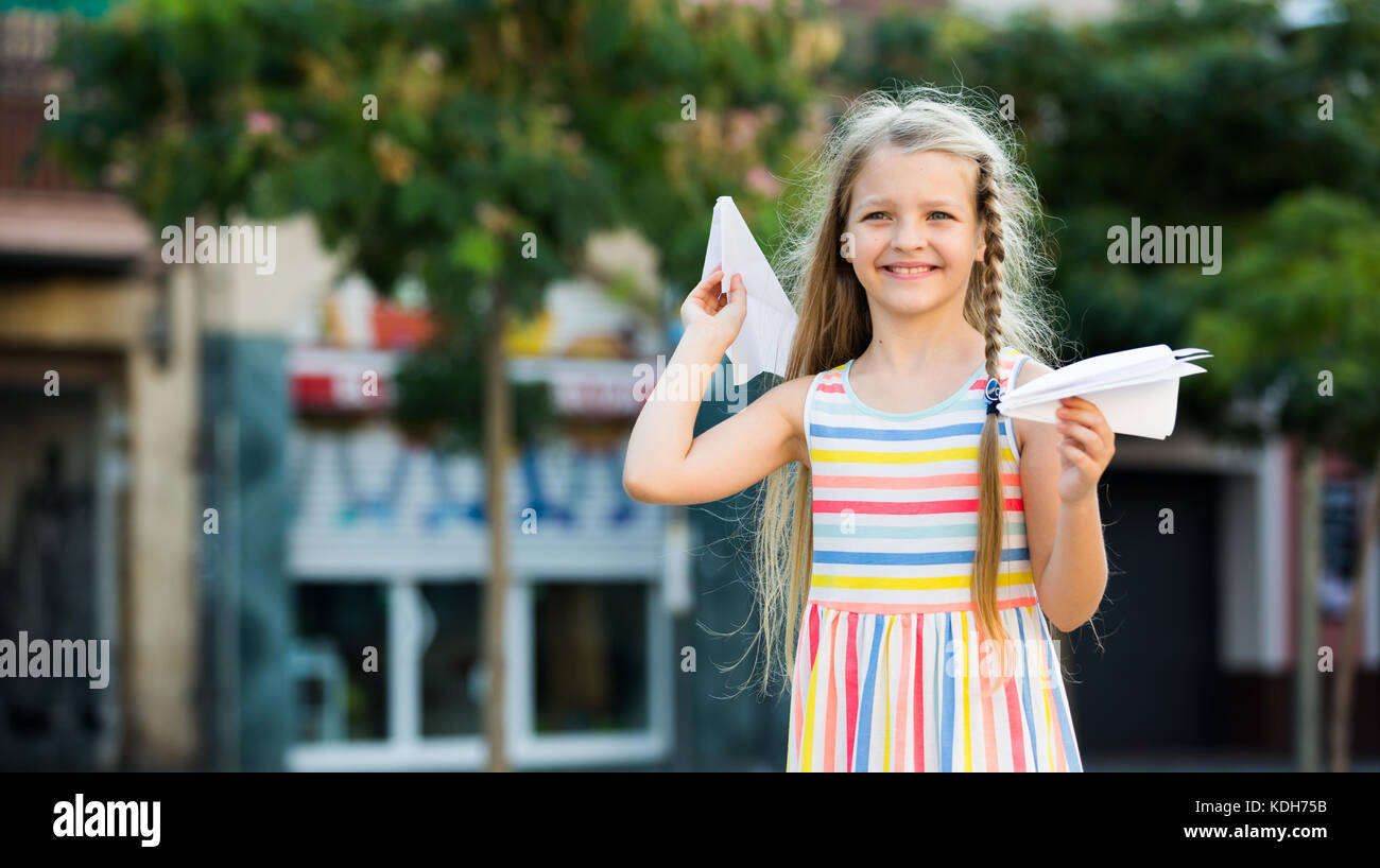 Happy girl throwing simple hi-res stock photography and images - Alamy