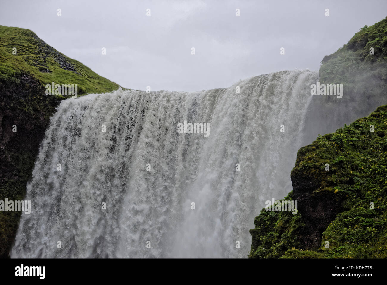Seljalandsfoss waterfall plunging 60m from the cliff above, Sudhurland ...