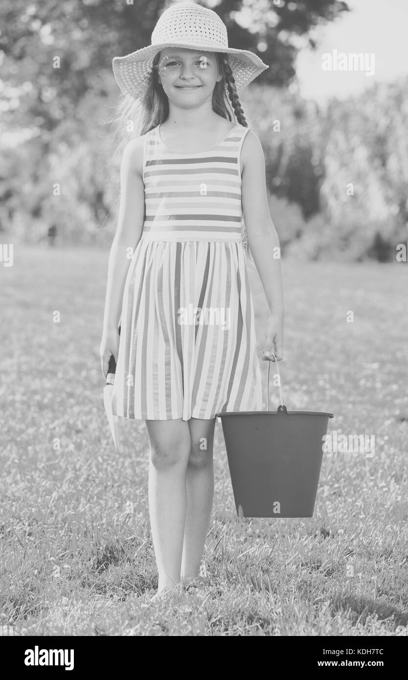 Girl carrying bucket Black and White Stock Photos & Images - Alamy