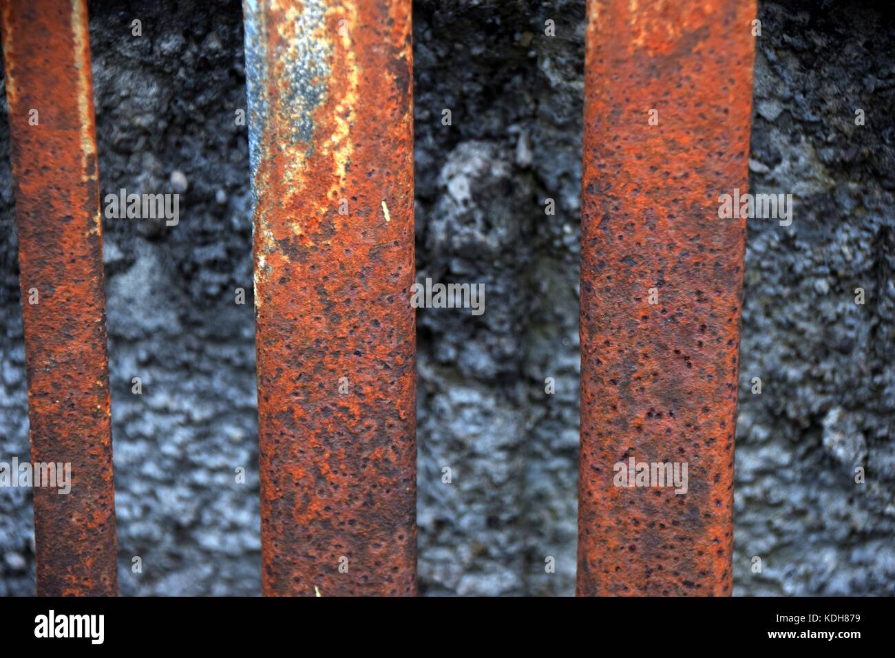 rusty surface, close-up of a rusted iron grid leaning against a wall ...