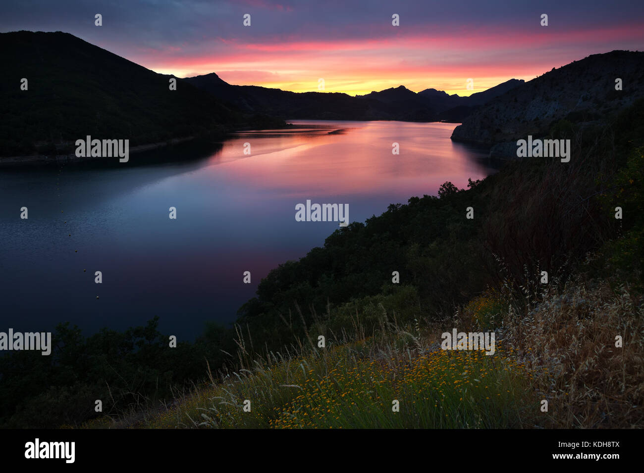 Summer mountains landscape with lake in sunset. Barrios de Luna ...
