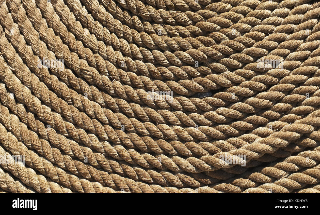 Nautical rope with gold colour as background image Stock Photo - Alamy
