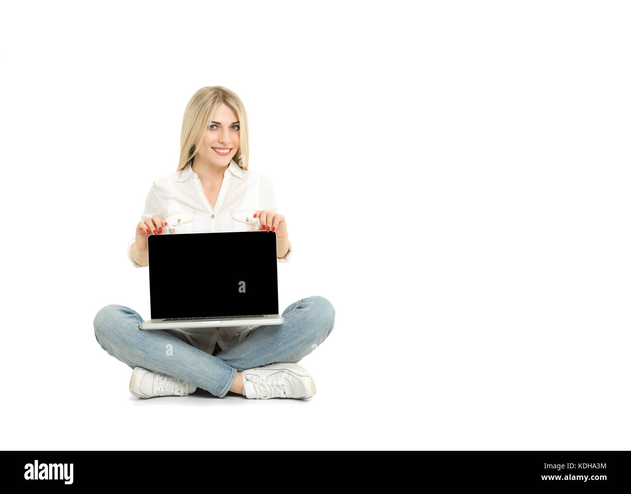 Young blonde woman showing blank laptop computer screen sitting on the ...