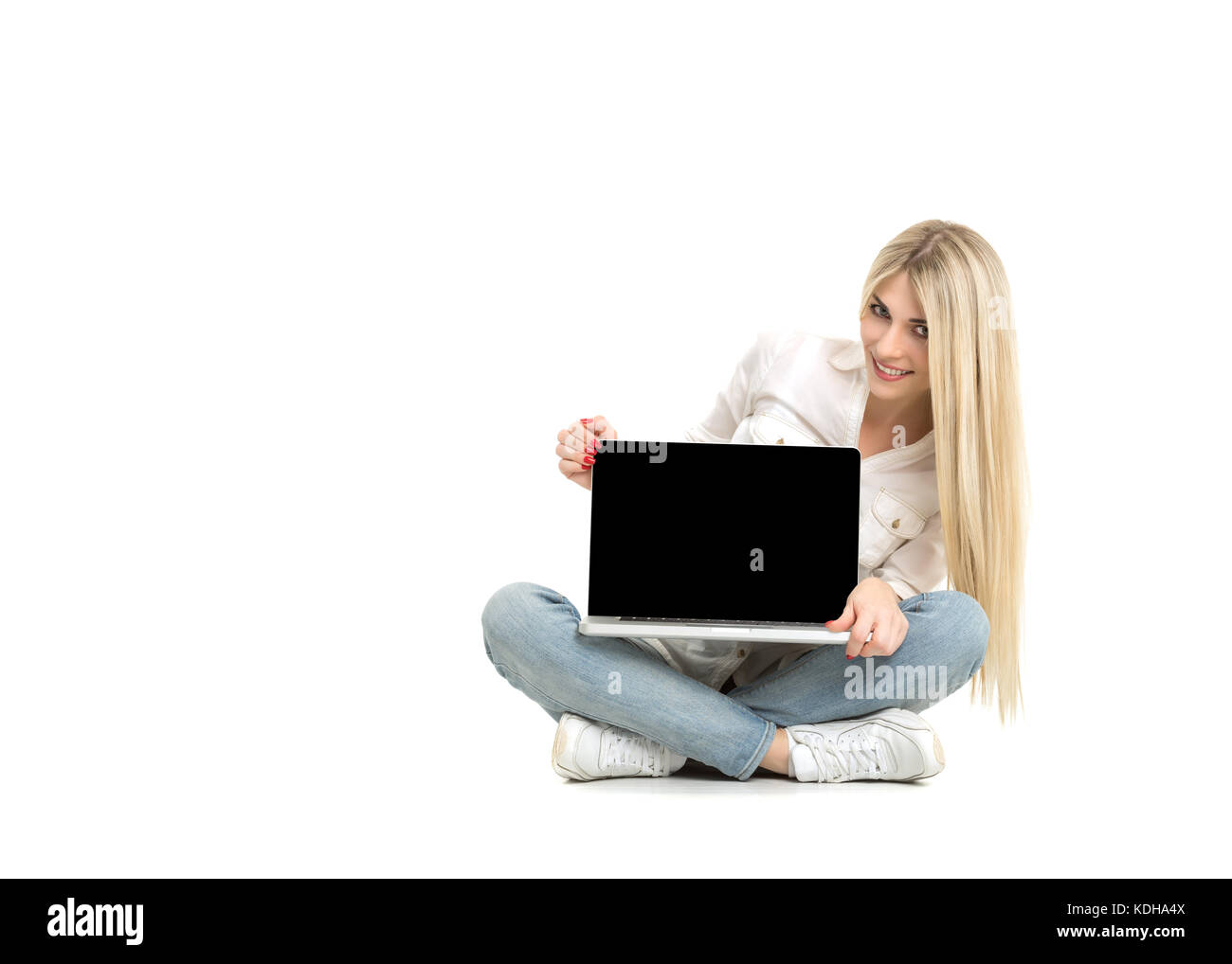 Young blonde woman showing blank laptop computer screen sitting on the ...