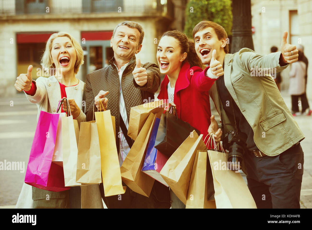 Close up of happy positive smiling tourists with purchases on European ...