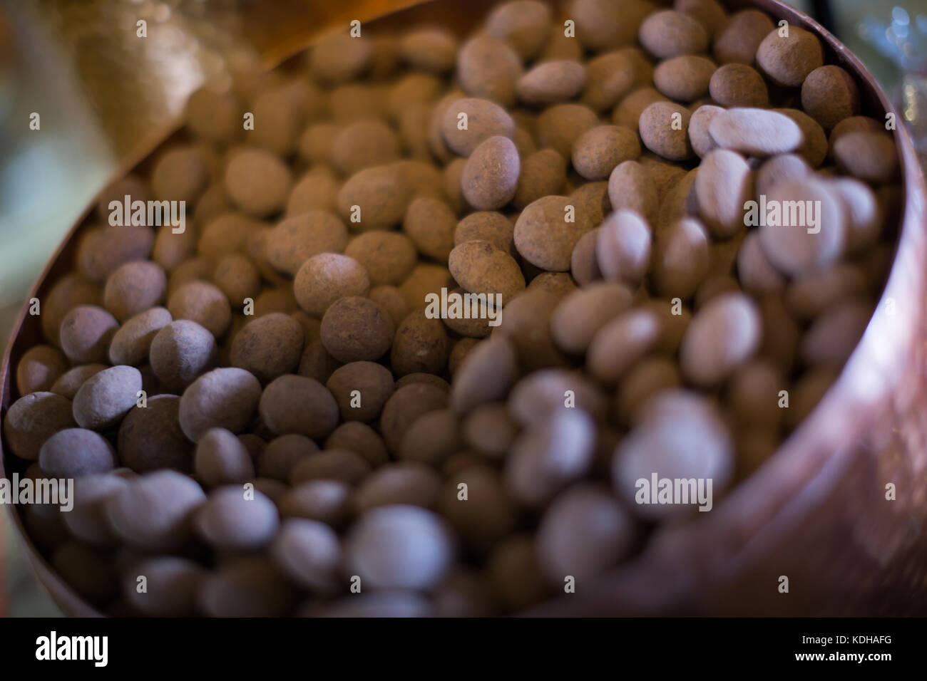 Container with cacao covered chocolate pellets in tea-room Stock Photo ...