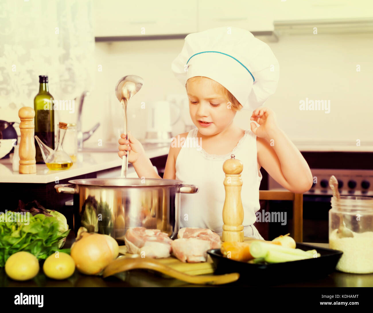 girl cooking soup in pan at kitchen Stock Photo - Alamy