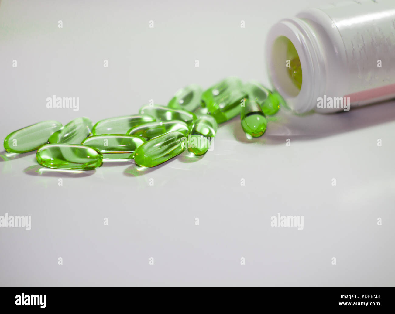 medication fish oil for heart health green pills on a with background ...