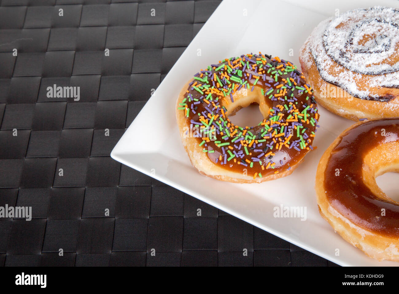 Close up detailed view of yummy donuts with chocolate, powdered sugar ...
