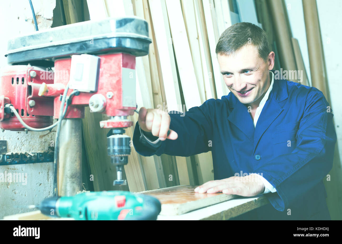 portrait of happy russian man in uniform working with electrical ...