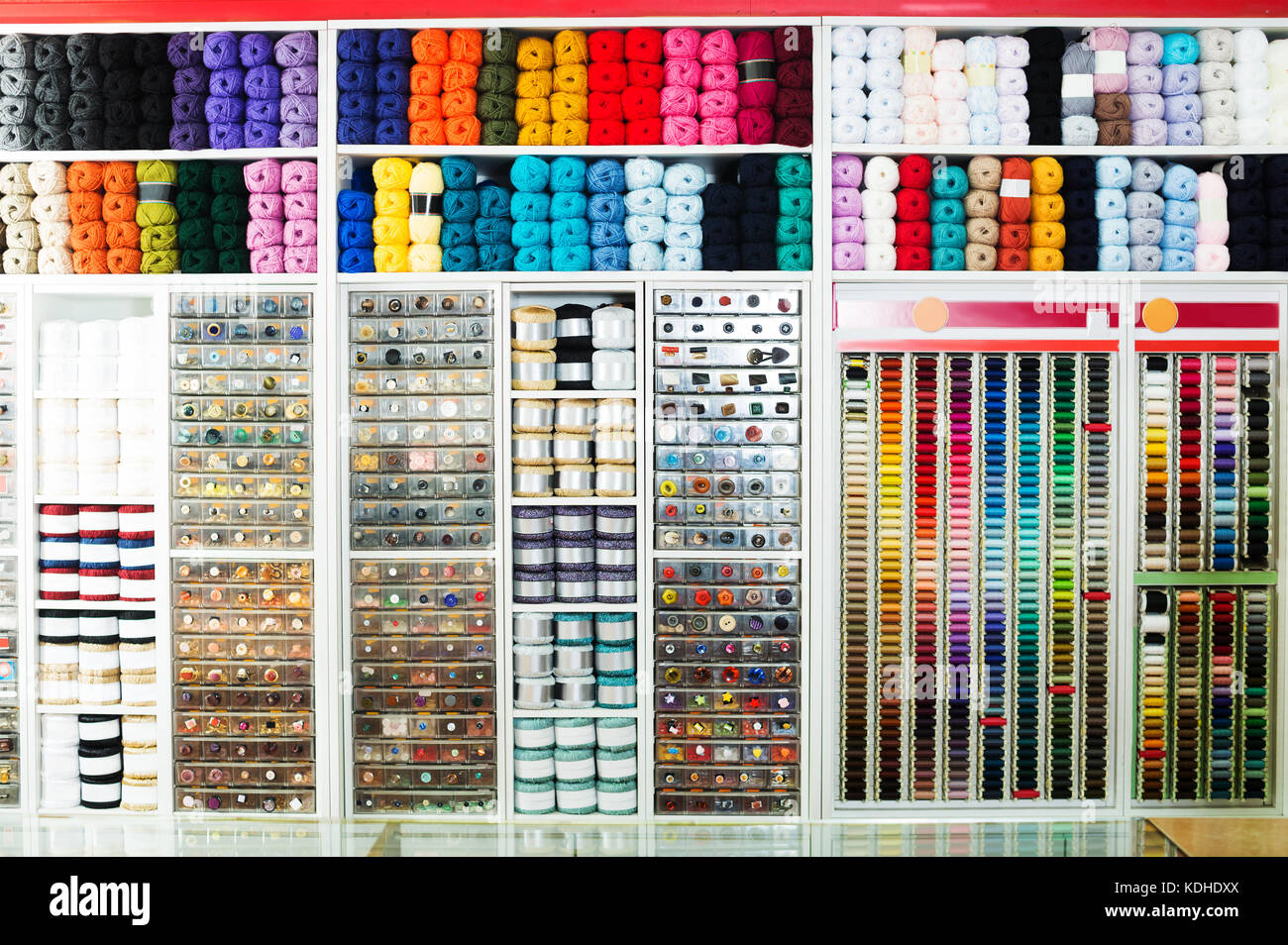 view on sewing shop shelves with various knitting yarn, buttons ...